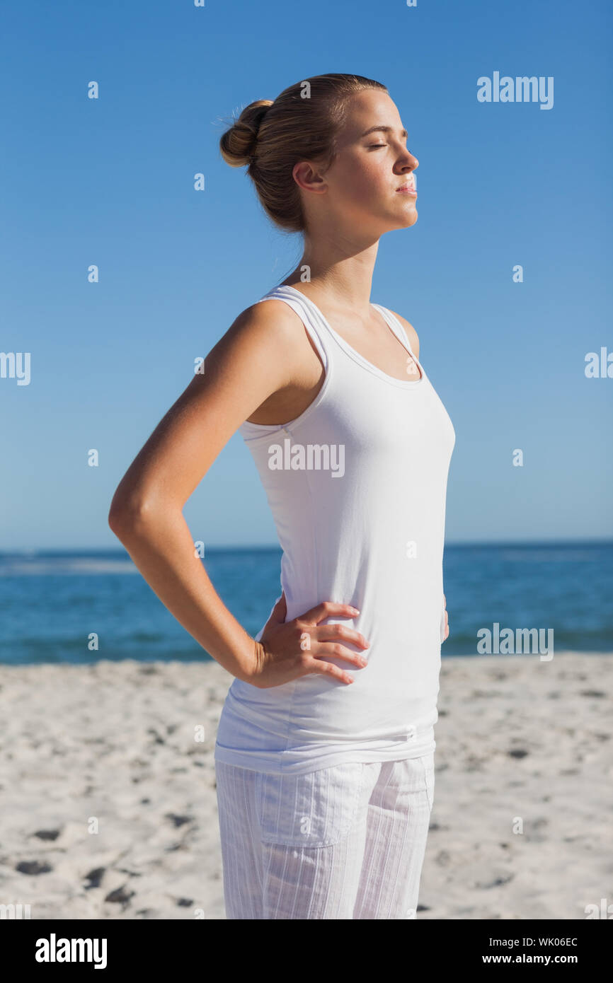 Attractive woman standing and relaxing Stock Photo - Alamy