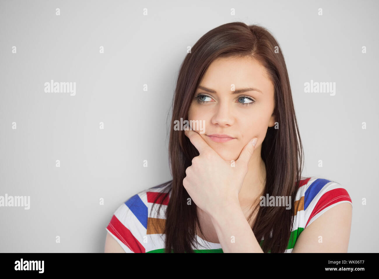 Thinking girl posing and looking away Stock Photo - Alamy