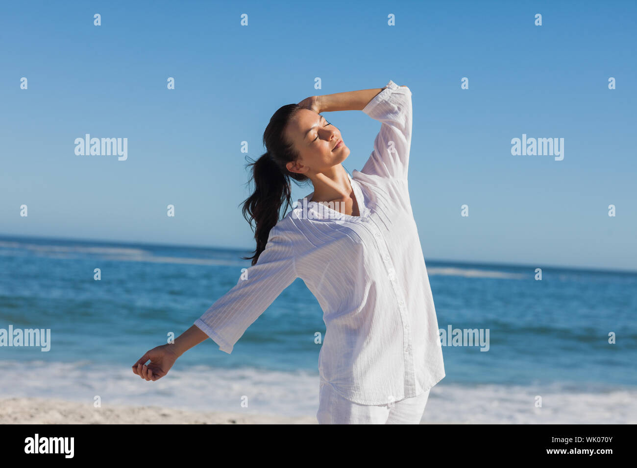 Attractive woman relaxing the sun Stock Photo - Alamy