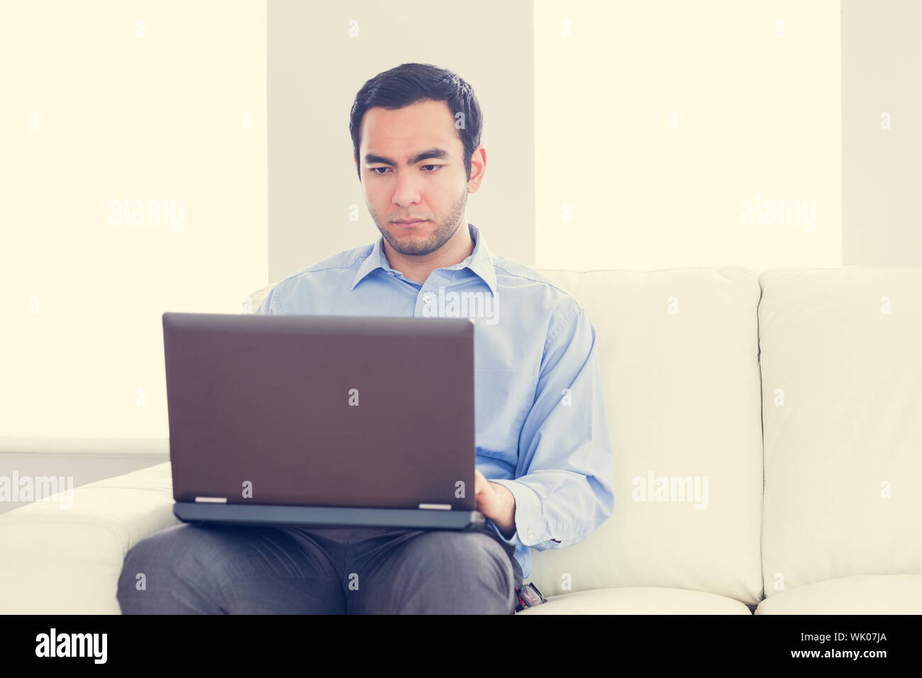 Young man sitting bored on hi-res stock photography and images - Alamy