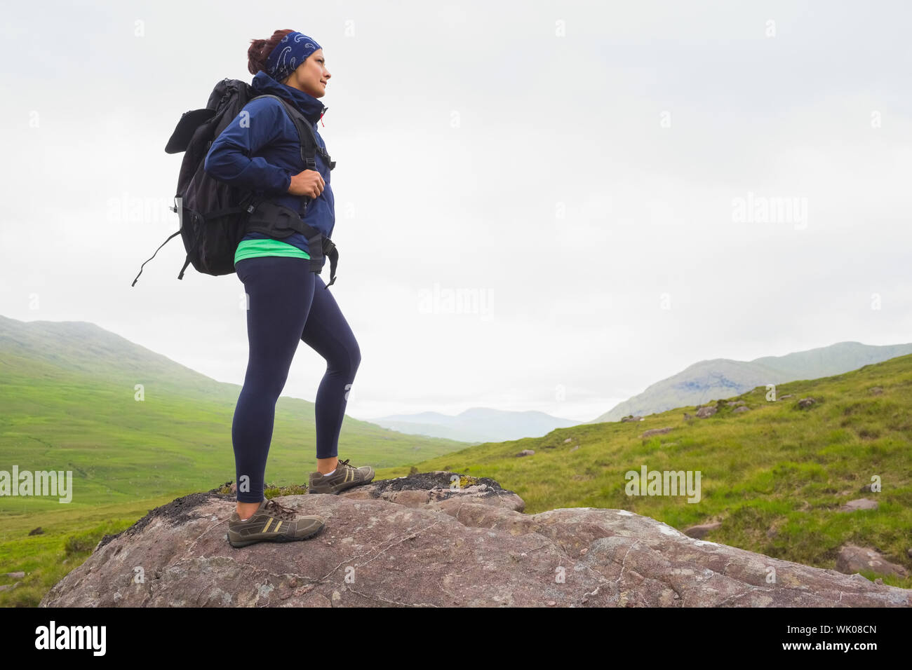 Woman standing on rock hi-res stock photography and images - Alamy