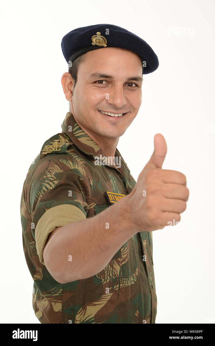 Portrait of an army soldier showing thumbs up sign and smiling Stock ...