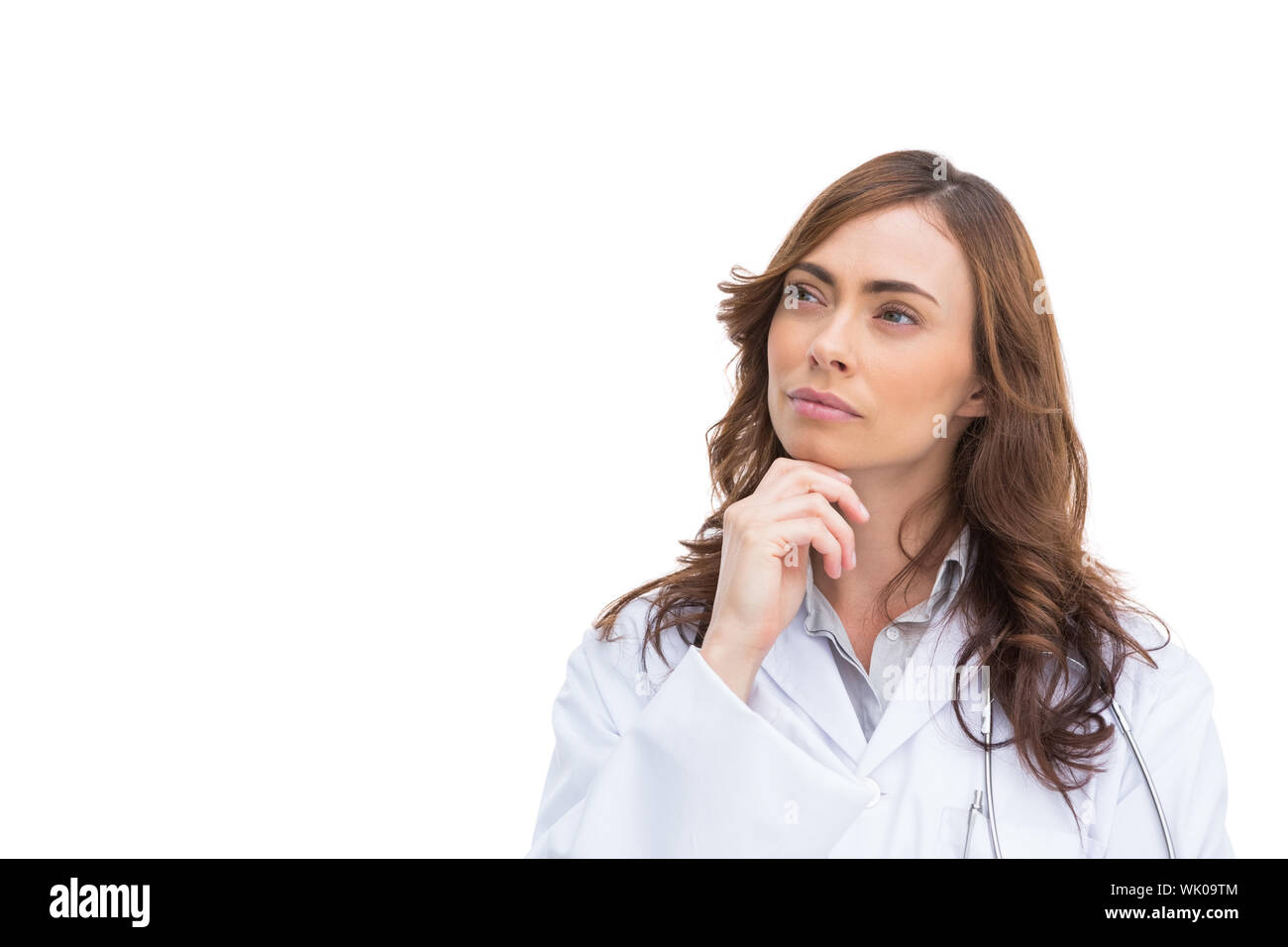 Concentrated pretty doctor posing Stock Photo - Alamy