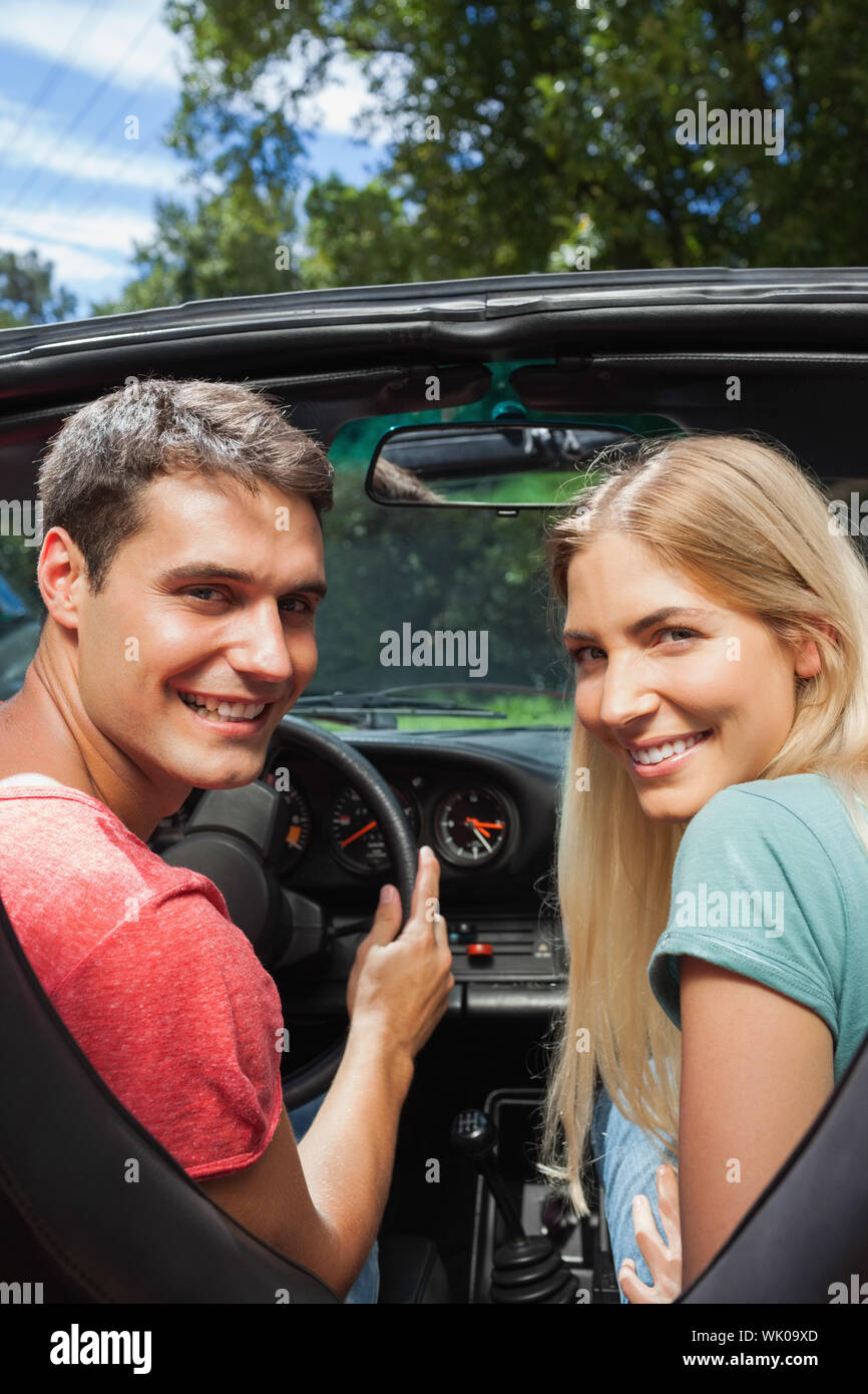 Woman looking over shoulder at man hi-res stock photography and images ...