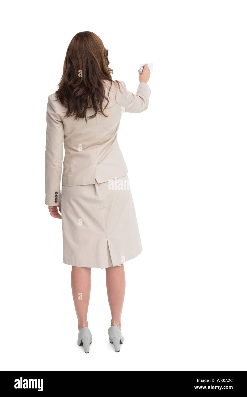 Businesswoman standing back to camera writing with marker Stock Photo ...
