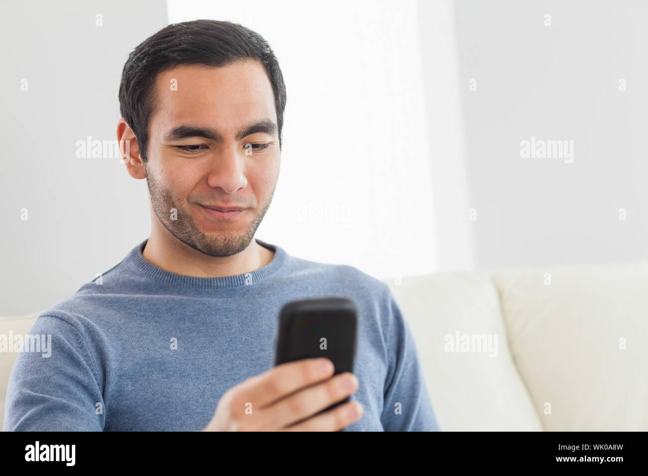 Calm man texting mobile phone hi-res stock photography and images - Alamy