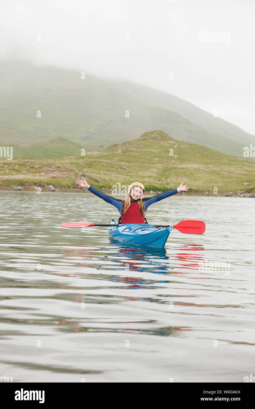 Blonde woman in a kayak Stock Photo - Alamy