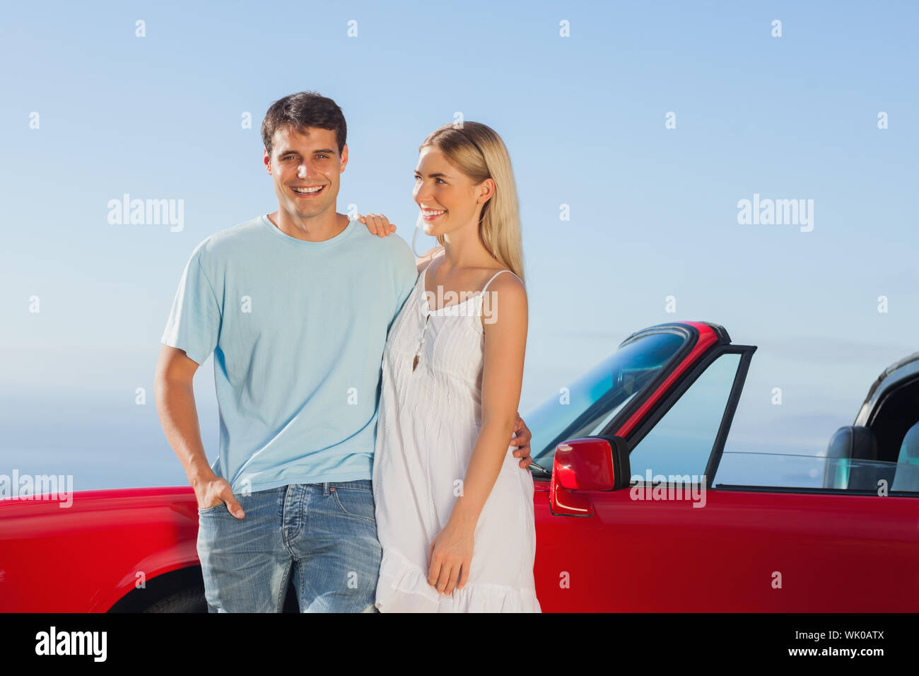 Smiling cute couple hugging Stock Photo - Alamy