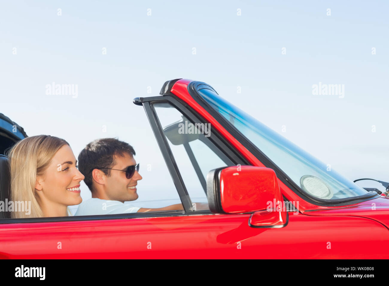 Happy couple going on holidays together Stock Photo - Alamy