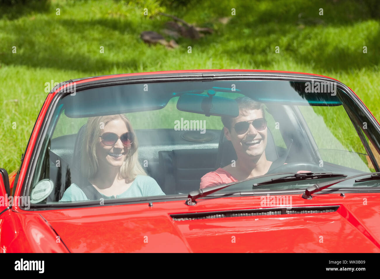 Happy young couple going for a ride together Stock Photo - Alamy