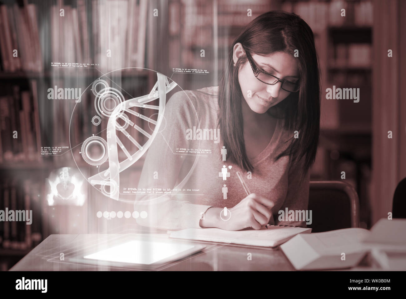 Black-haired woman studying in the library Stock Photo - Alamy