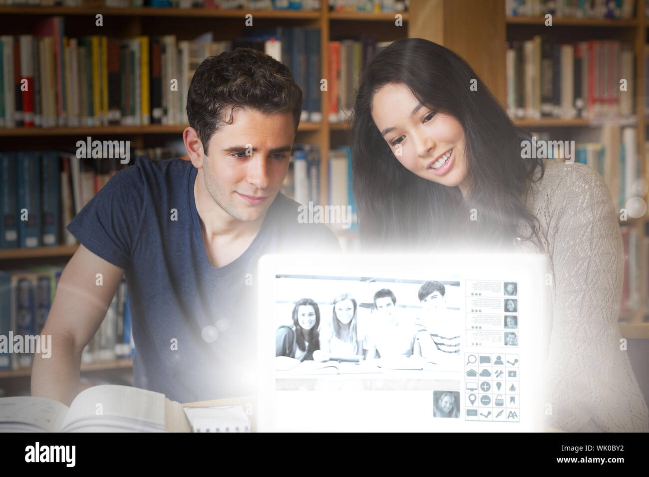 Cheerful college friends watching photos hi-res stock photography and ...