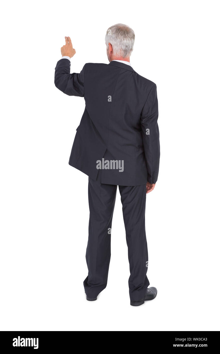 Rear view of classy mature businessman pointing finger Stock Photo - Alamy