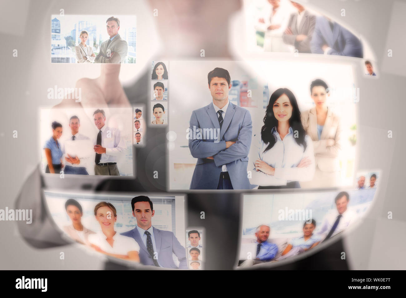 Concentrated businessman selecting a picture Stock Photo - Alamy