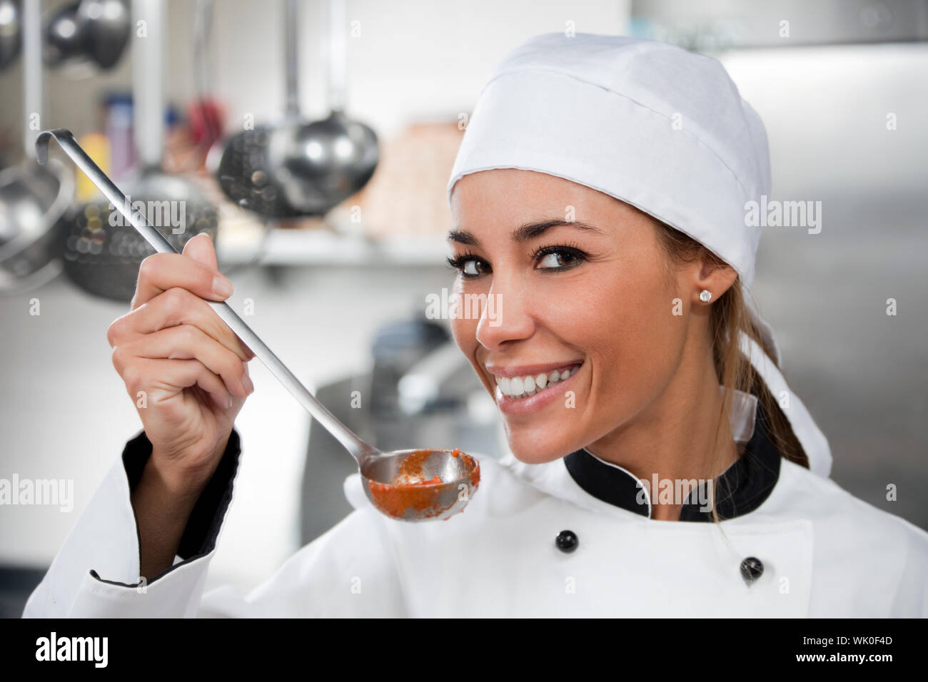 female chef looking at camera and smiling Stock Photo - Alamy