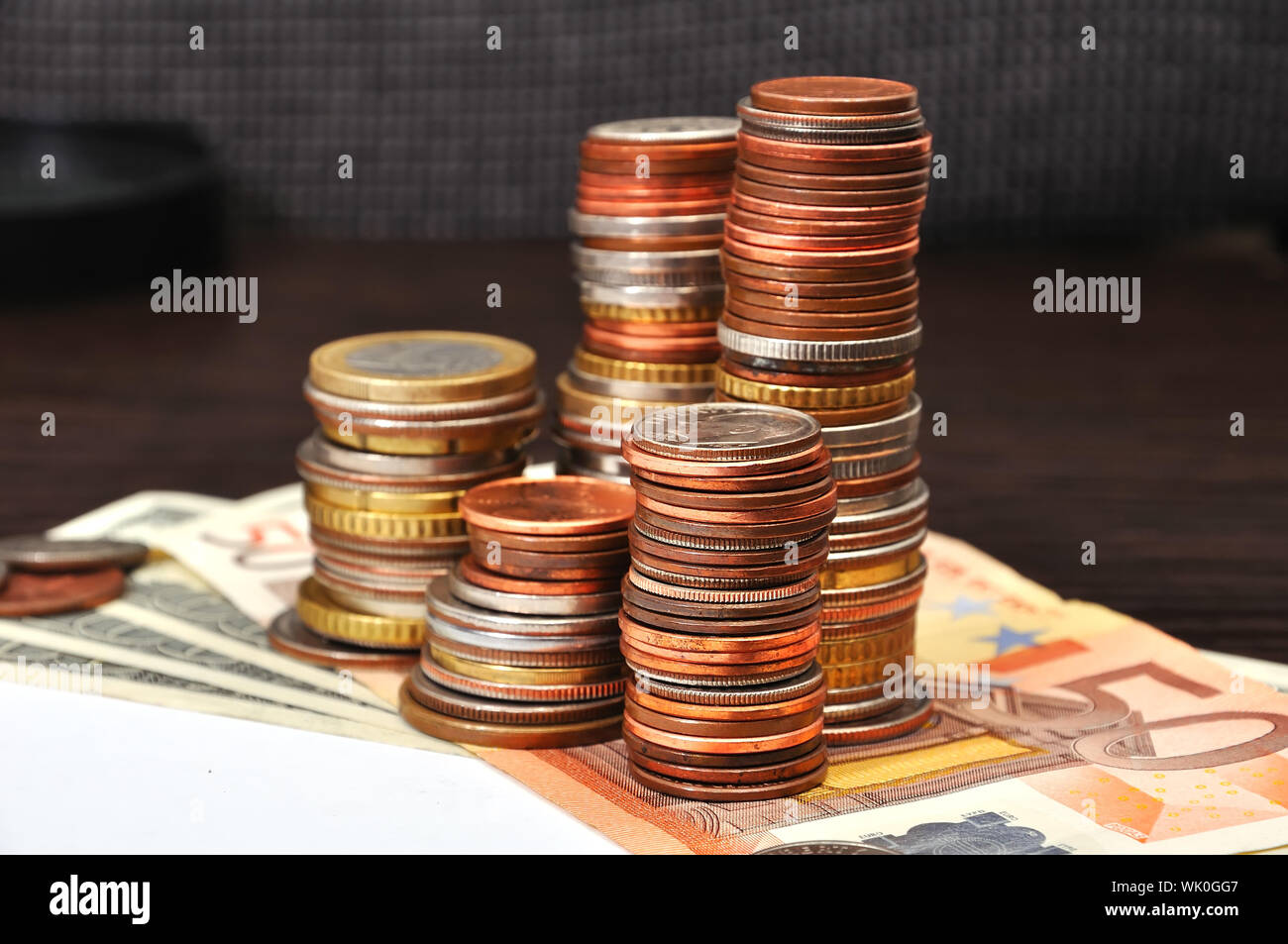 Different currency of paper euro money and coins Stock Photo - Alamy