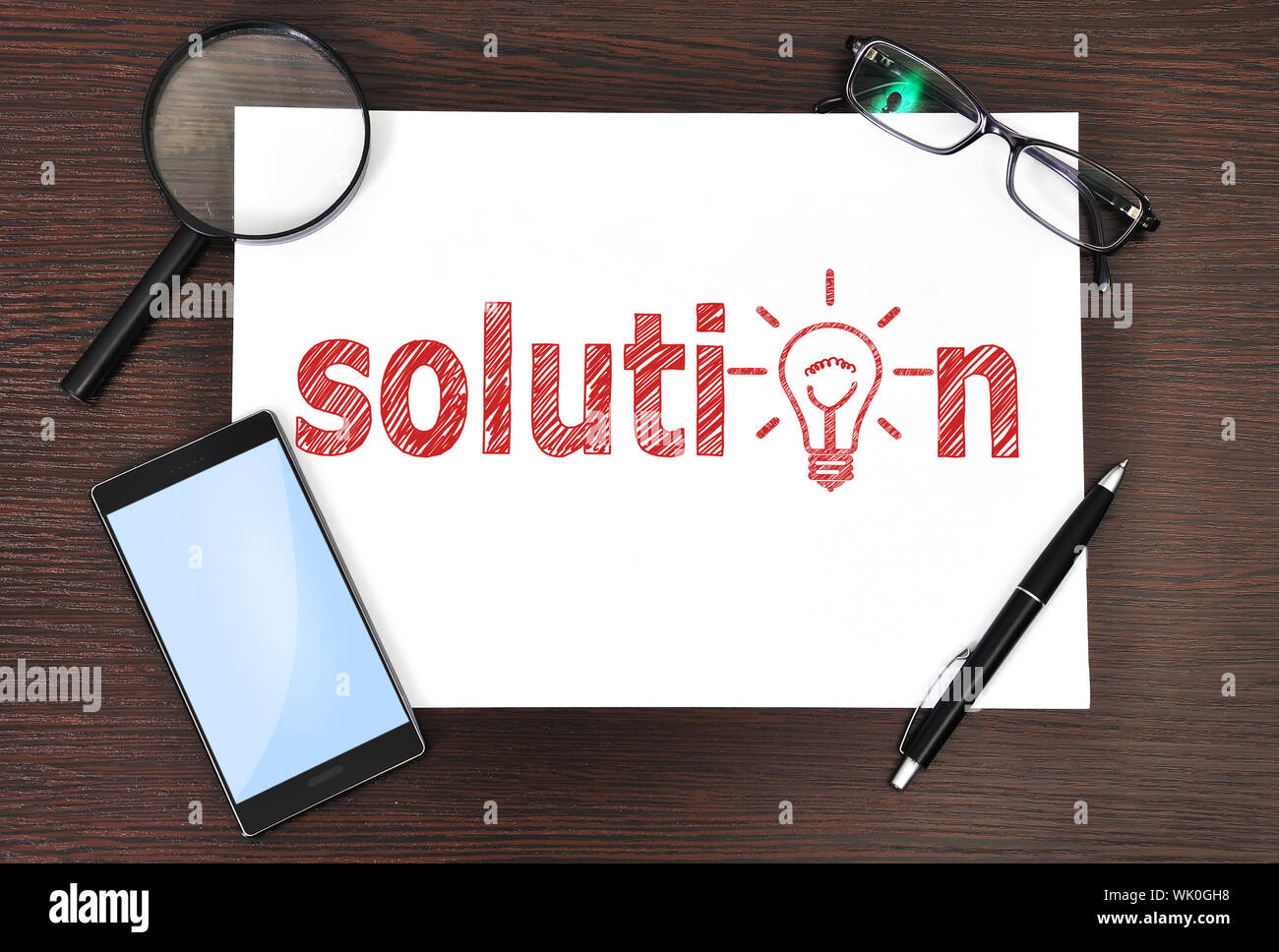Office desktop, paper with solution Stock Photo - Alamy