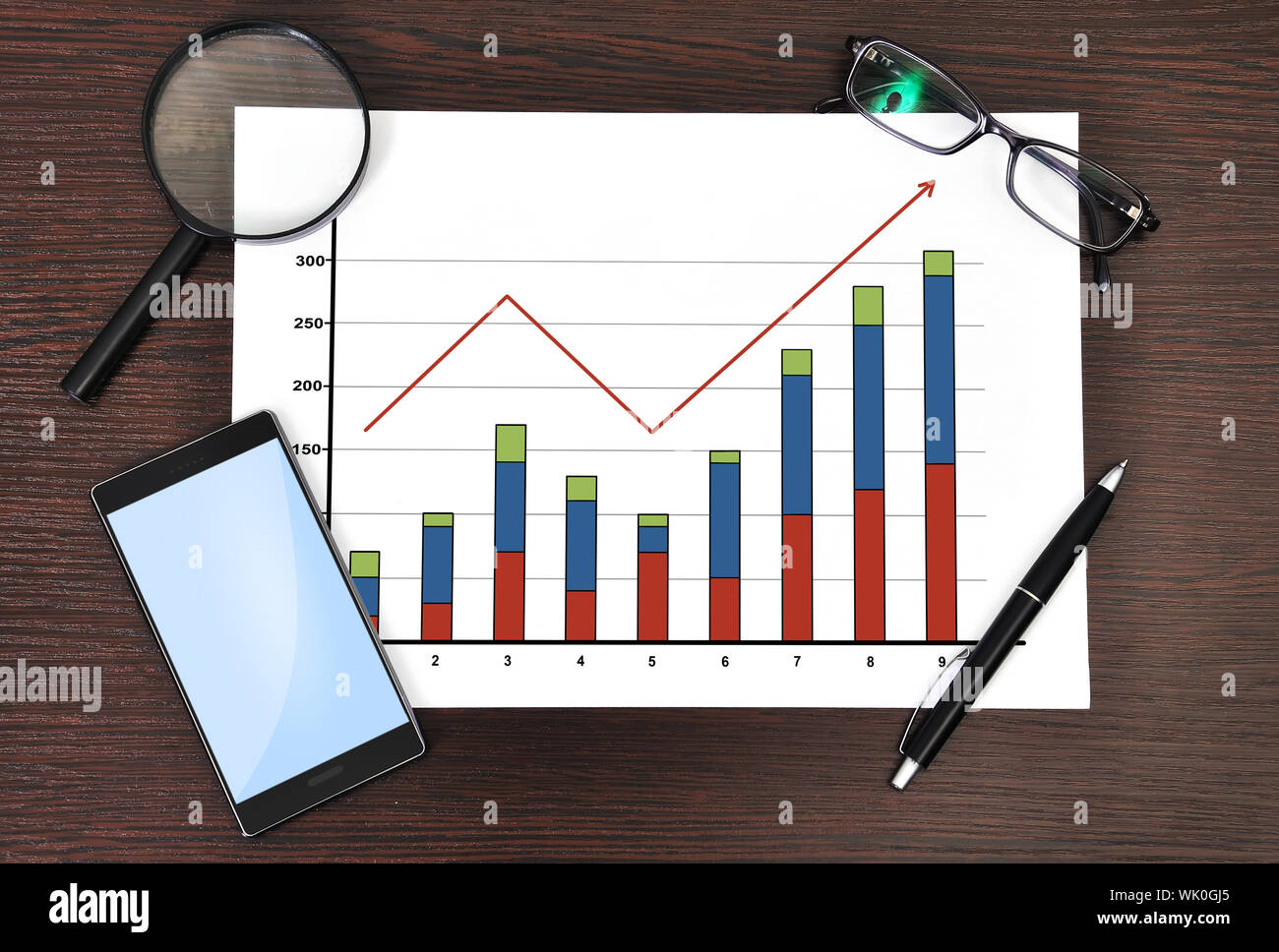 Office desktop, paper with business graphic Stock Photo - Alamy