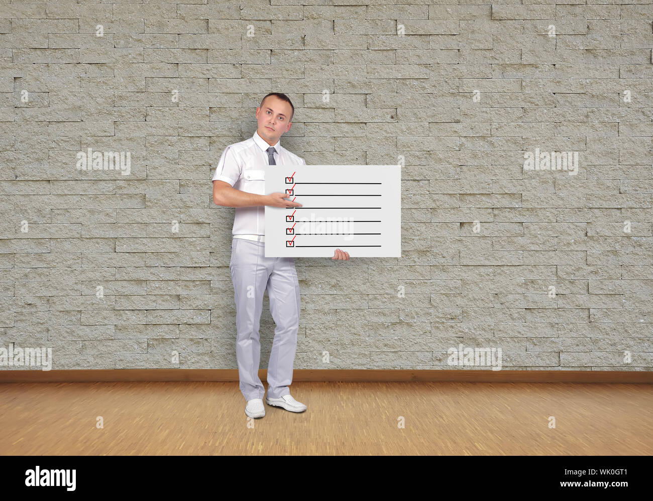 businessman holding placard with check box Stock Photo - Alamy