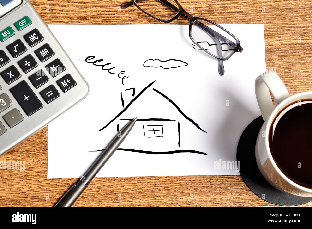 drawing abstract house on businessman desktop Stock Photo - Alamy