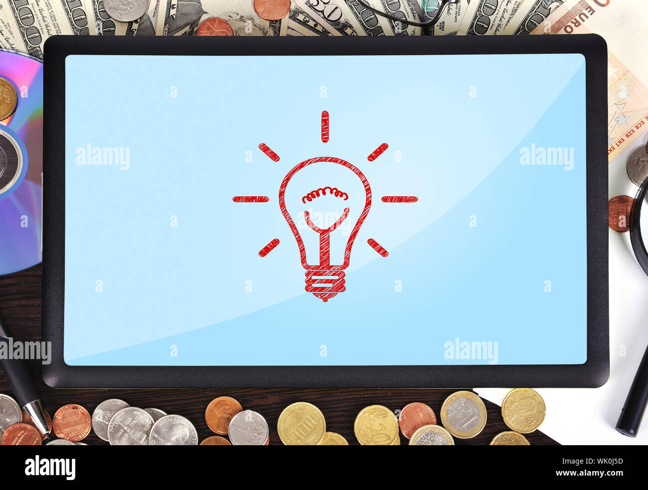 Modern business workplace: tablet with light bulb Stock Photo - Alamy