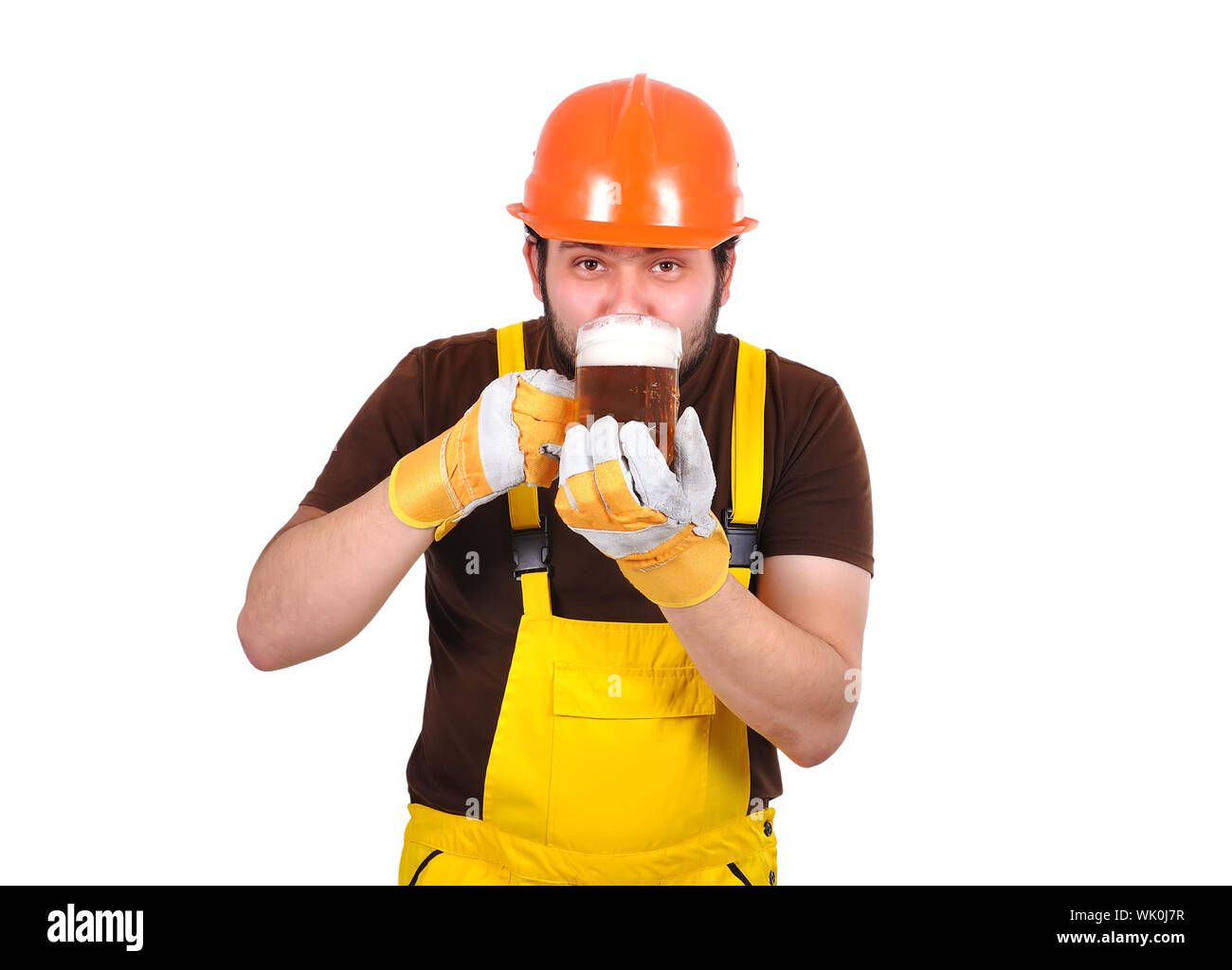 builder drinking beer on a white background Stock Photo - Alamy