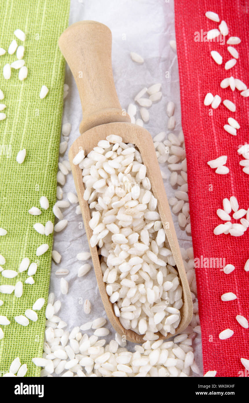 raw risotto rice on a wooden shovel Stock Photo - Alamy