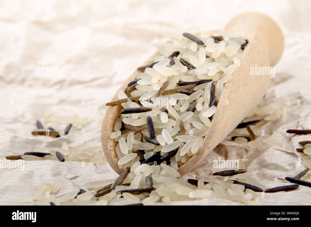 wild rice on a wooden shovel and white paper Stock Photo - Alamy