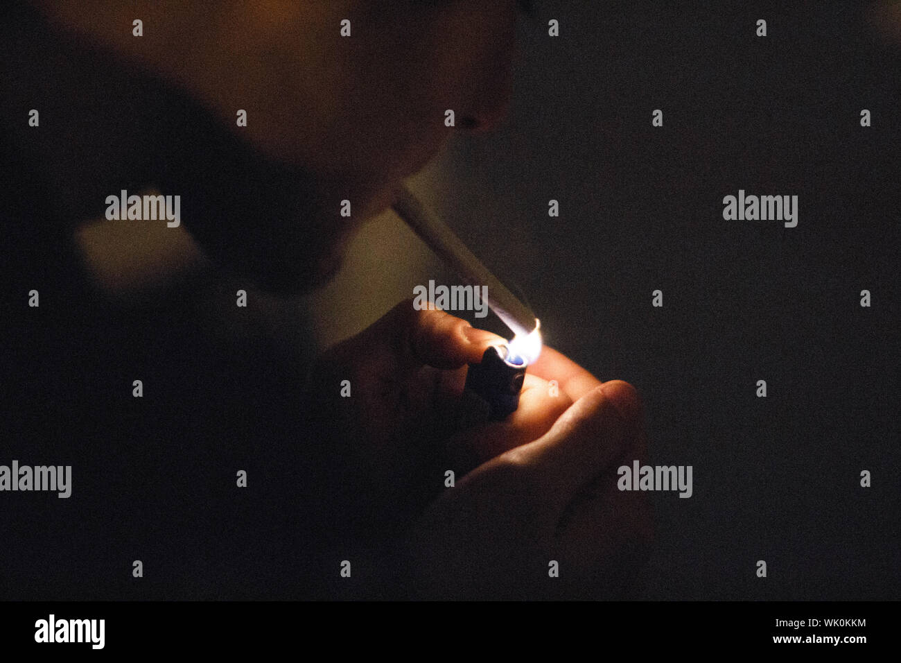 Man lighting up cigarette hi-res stock photography and images - Alamy