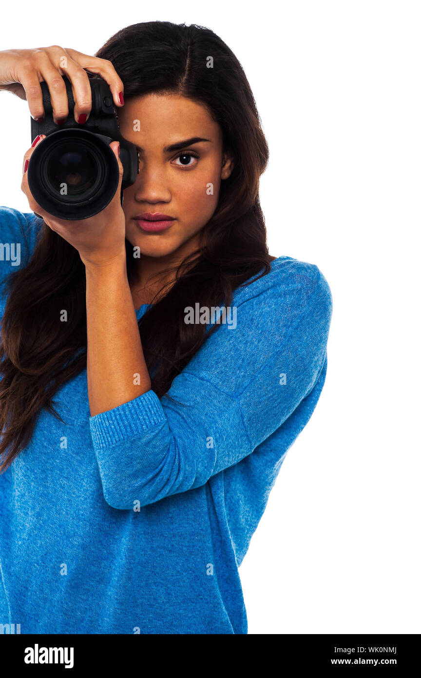 Beautiful female photographer taking a snap Stock Photo - Alamy