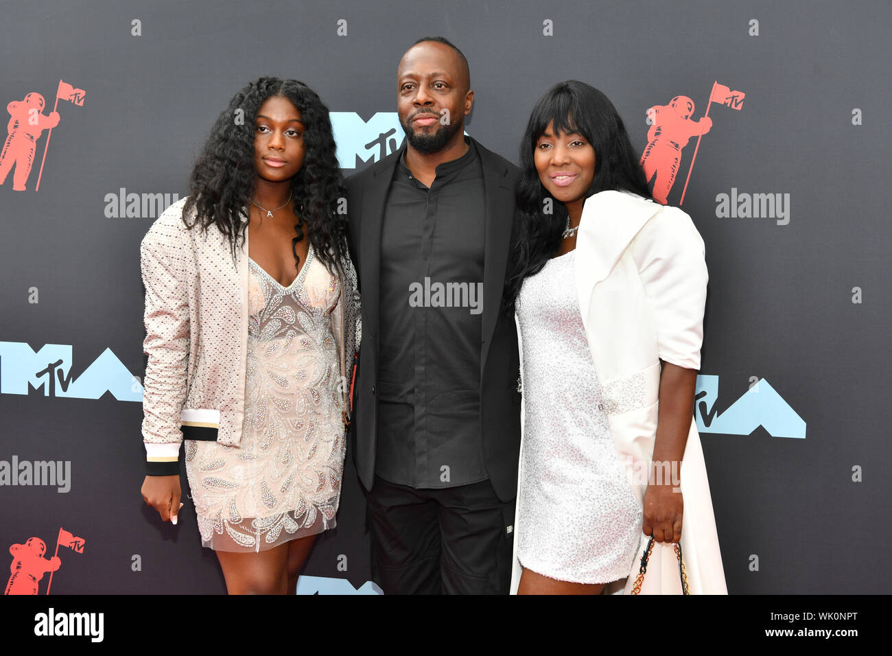 Angelina Jean, Haitian rapper Wyclef Jean and Claudinette Jean attend ...