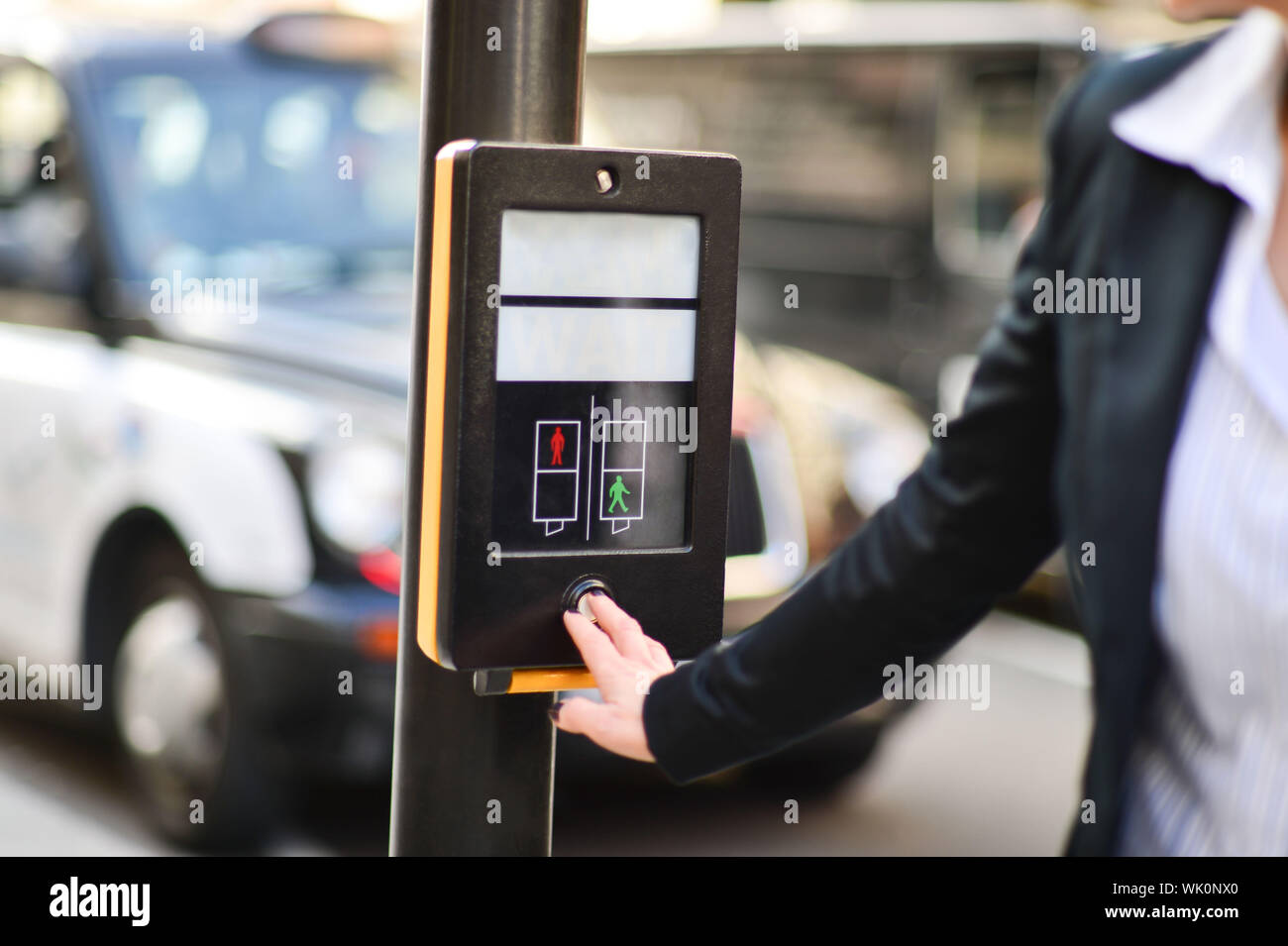 Hand pushing pedestrian crossing hi-res stock photography and images ...
