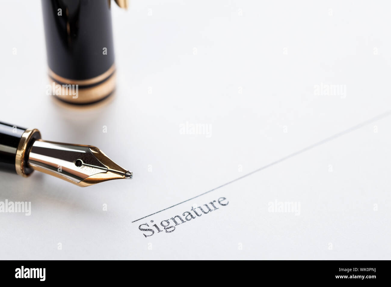macro closeup sign document contract pen filler Stock Photo - Alamy