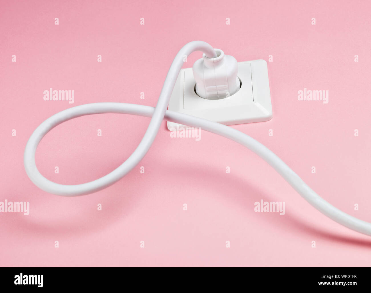 Electric Power Cable on Pink Background Stock Photo - Alamy