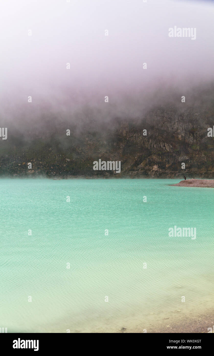 Fog forming on volcanic crater lake surface in Bandung, West Jawa Stock ...
