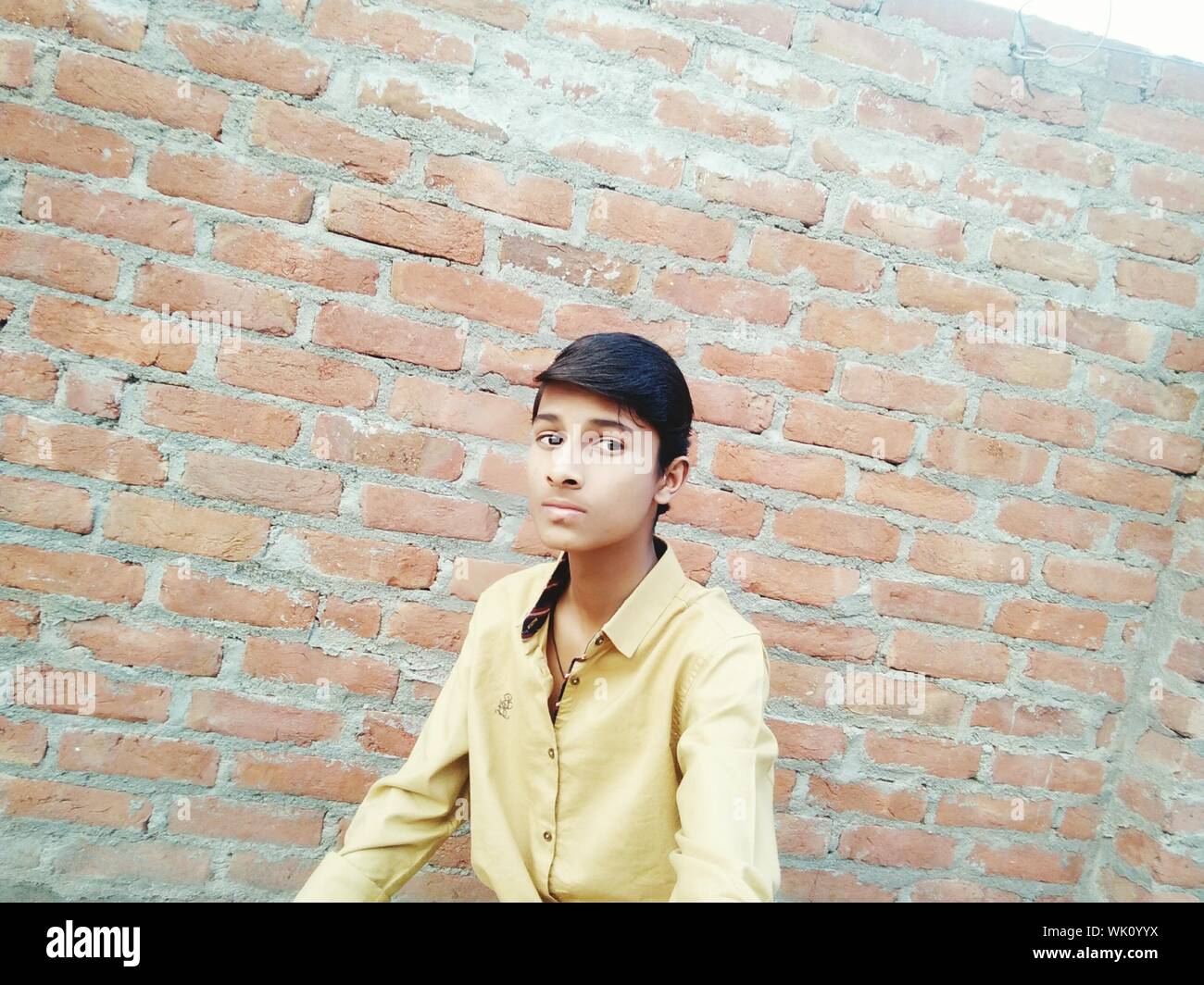 Black Boy Brick Wall High Resolution Stock Photography and Images - Alamy