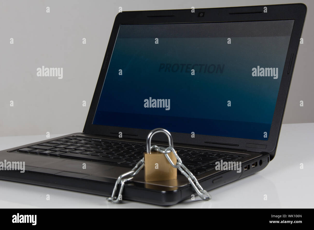 Chain and lock on laptop Stock Photo - Alamy