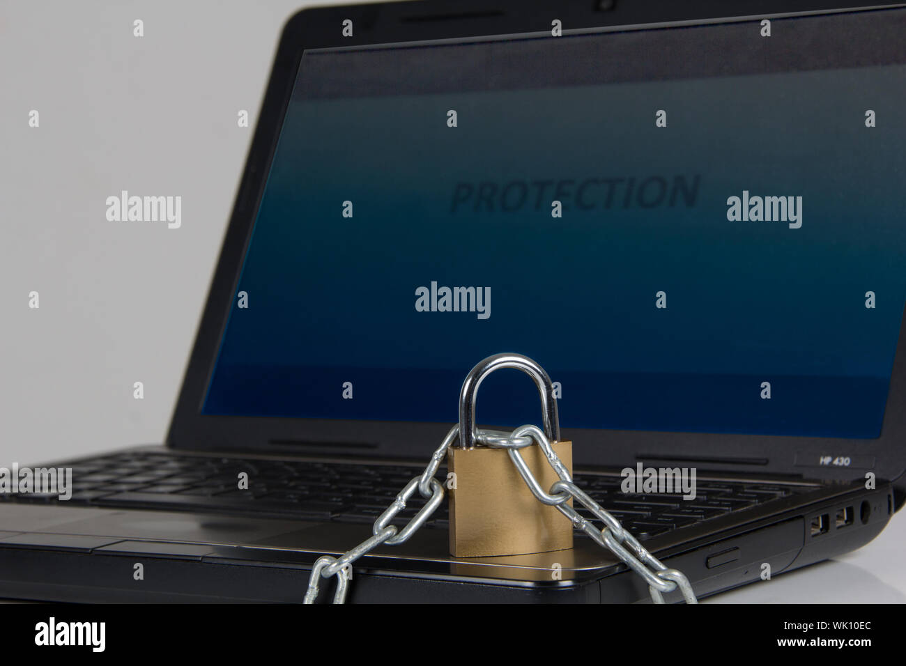 Chain and lock on laptop Stock Photo - Alamy