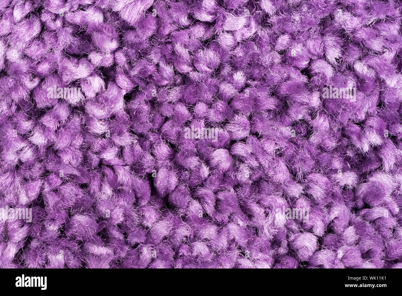 Closeup detail of purple carpet texture background Stock Photo - Alamy