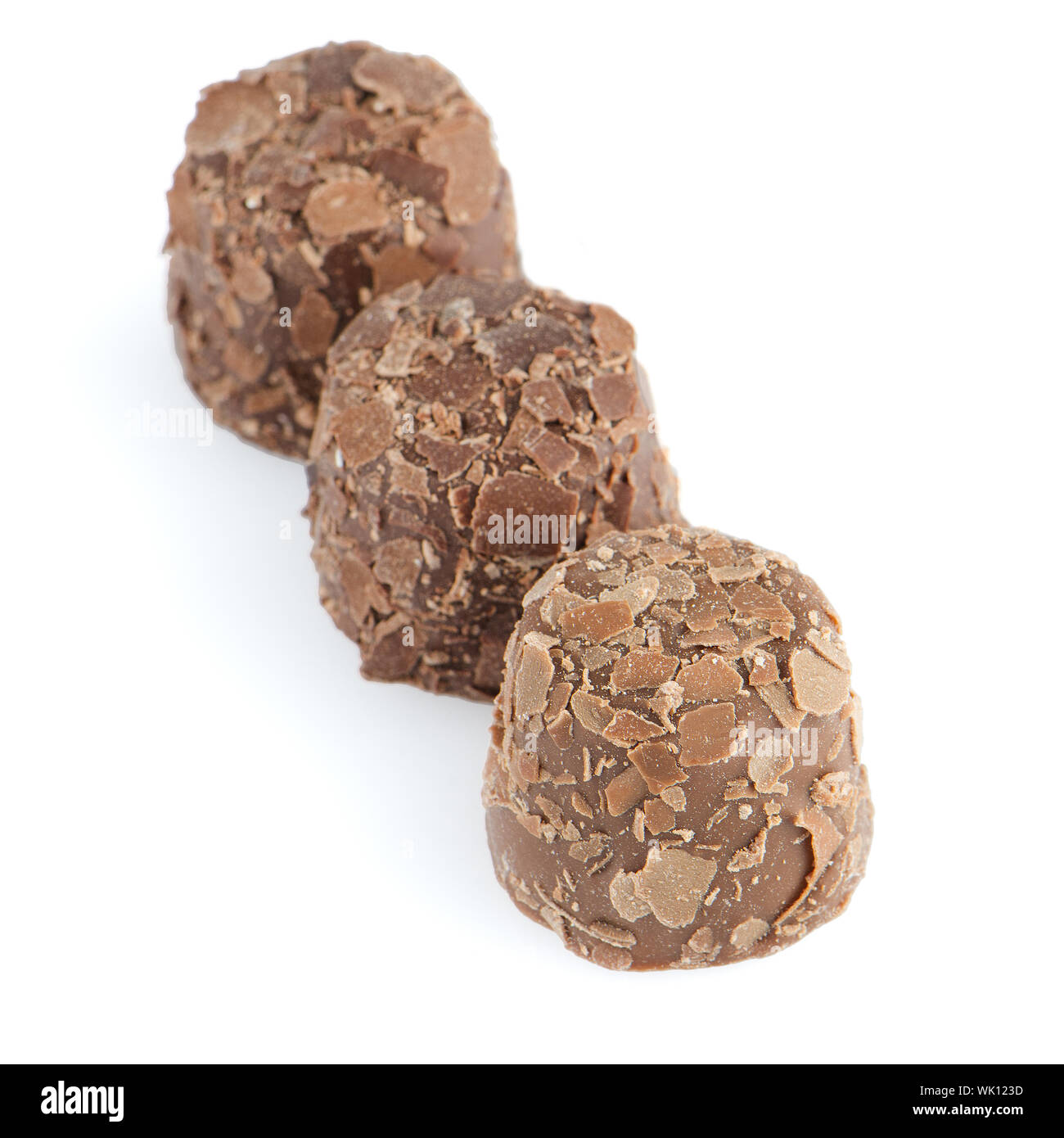 Brown chocolate candies isolated on white background Stock Photo - Alamy