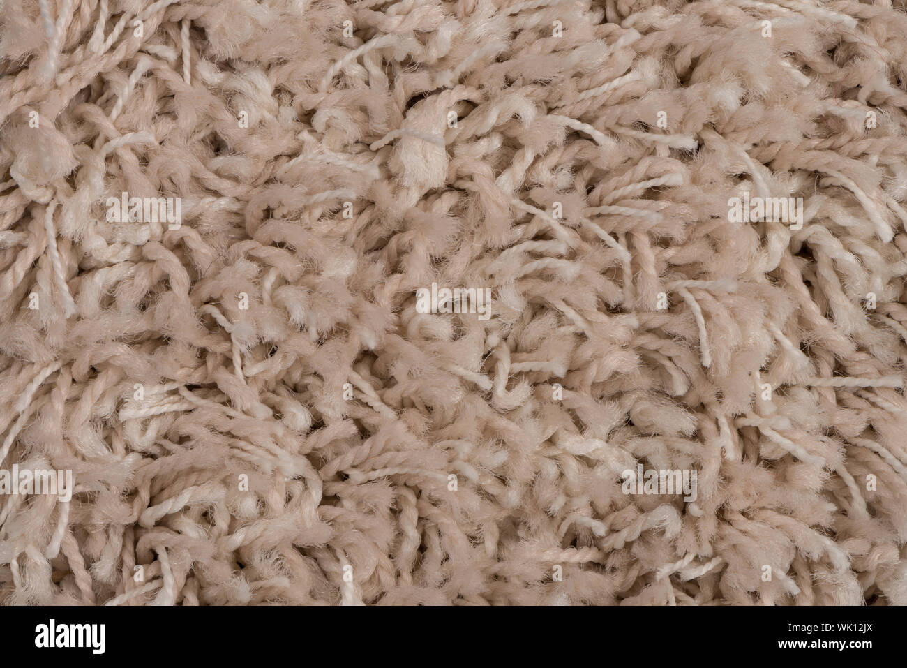 Closeup detail of beige carpet texture background Stock Photo - Alamy