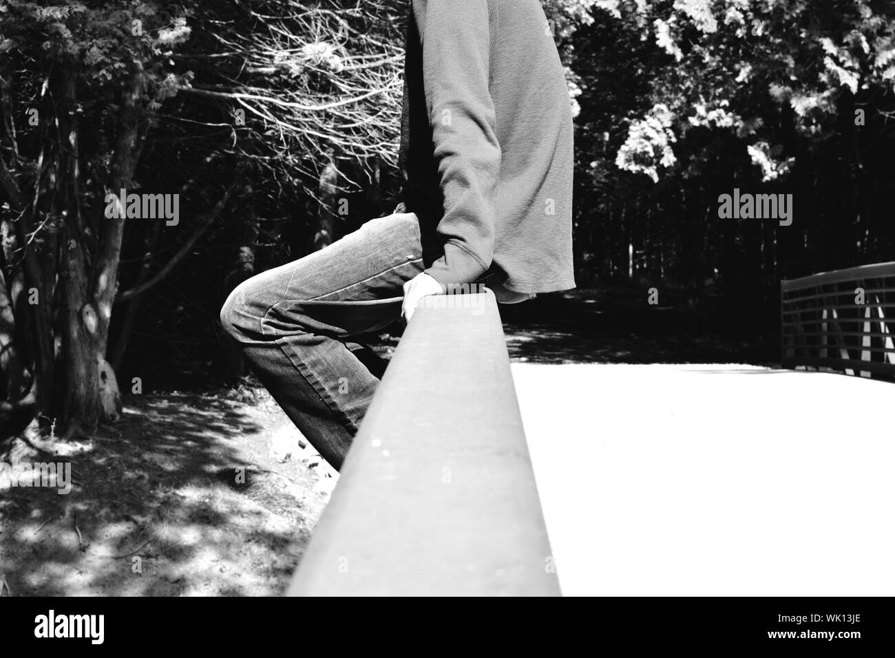 Man sitting on ledge hi-res stock photography and images - Alamy