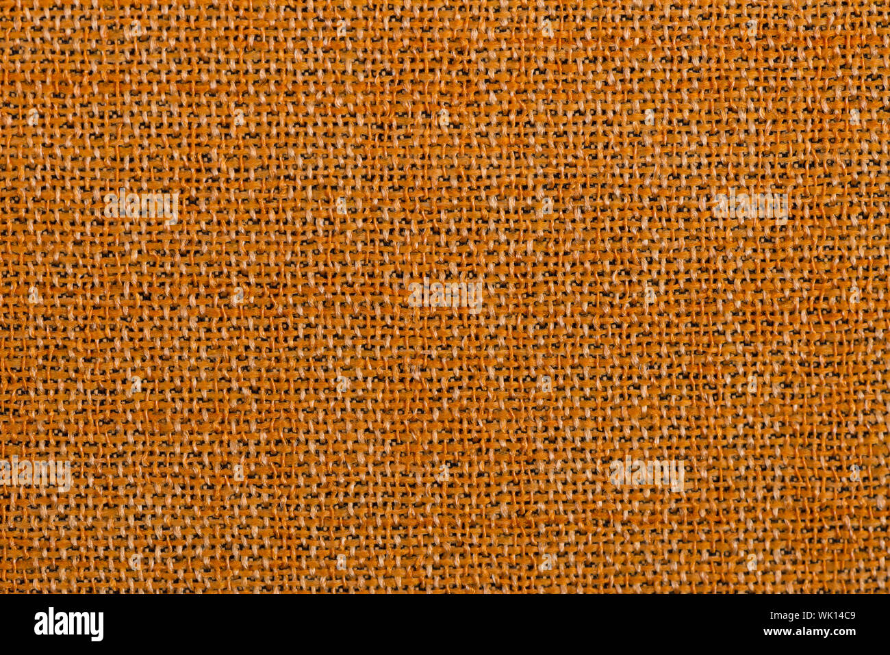 Closeup detail of orange fabric texture background Stock Photo - Alamy