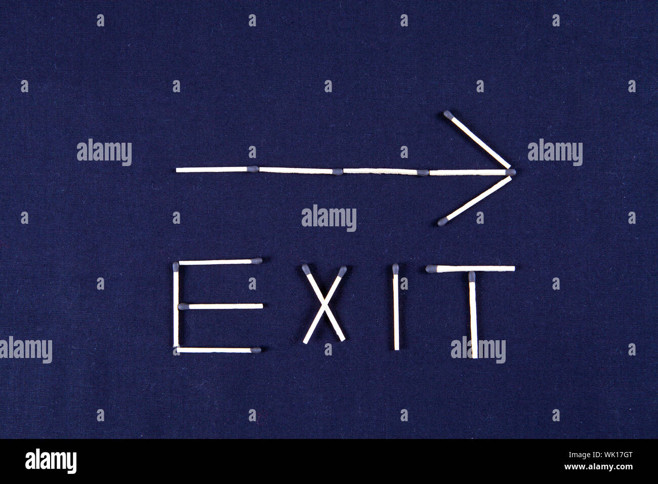Exit sign made with matchstick Stock Photo - Alamy