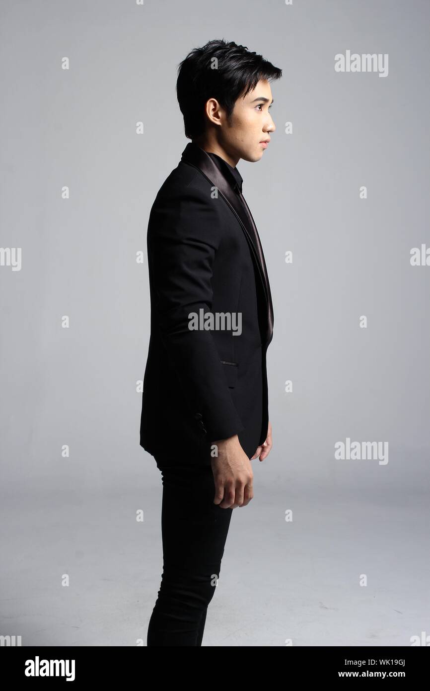 Man standing side view suit hi-res stock photography and images - Alamy