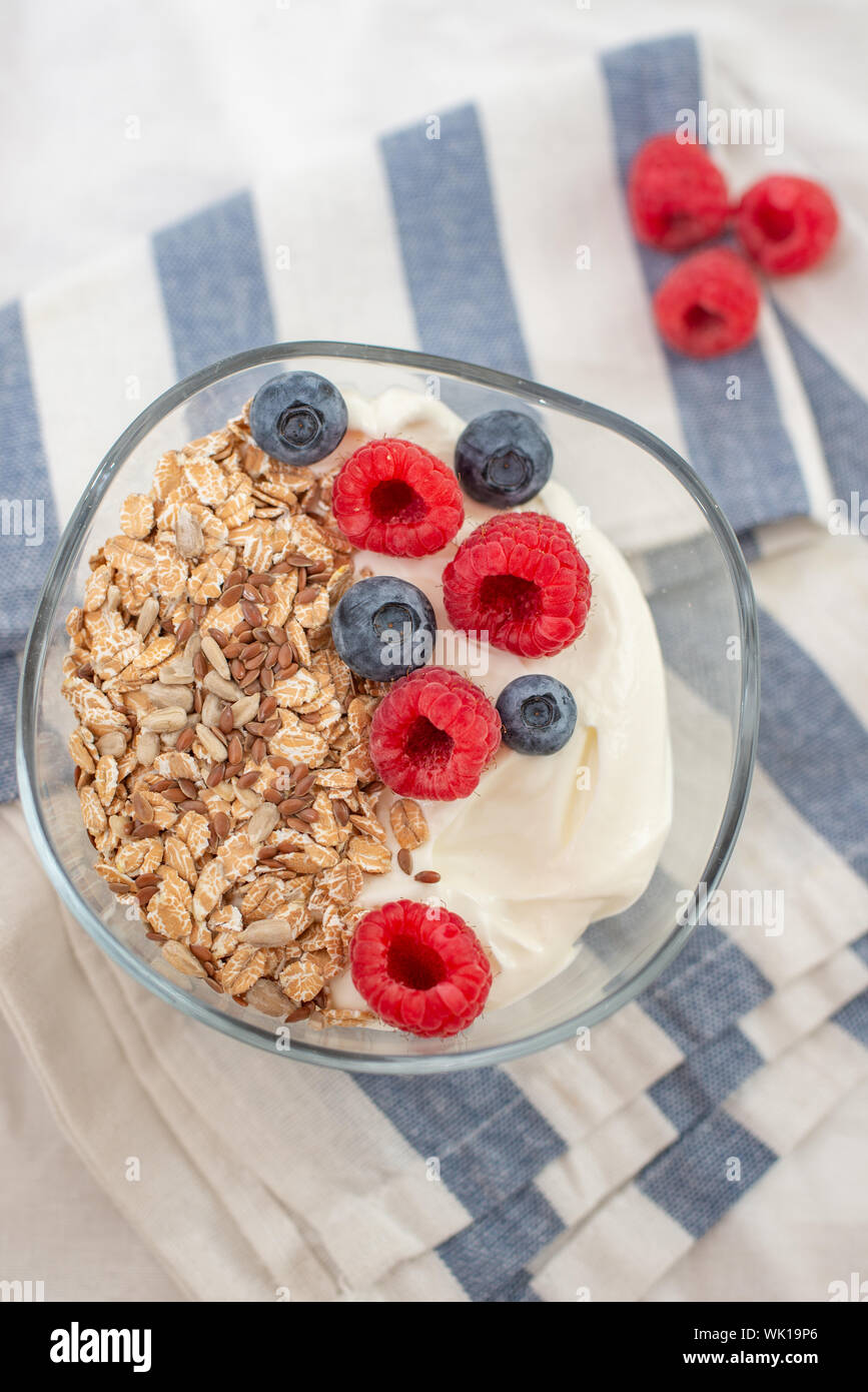 Yogurt with granola and berries Stock Photo - Alamy