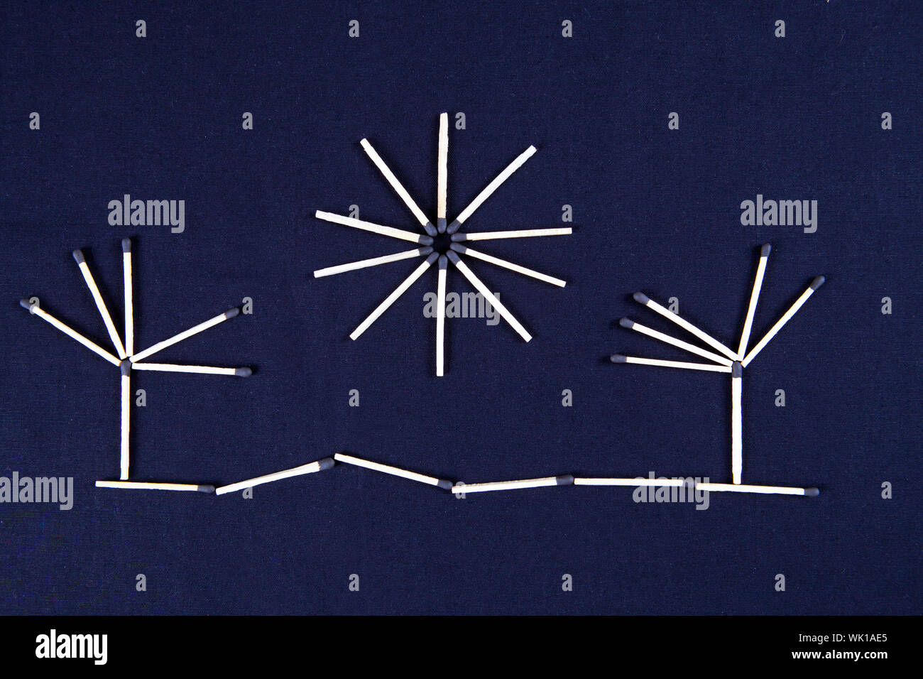 Tree with sun made with matchstick representing "Environment ...