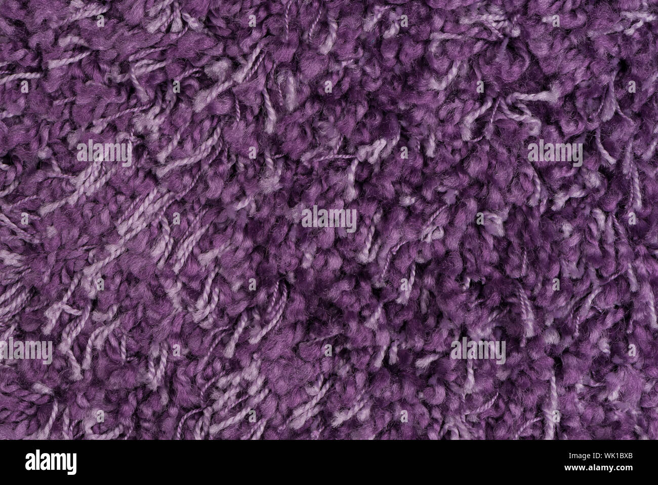 Closeup detail of purple carpet texture background Stock Photo - Alamy
