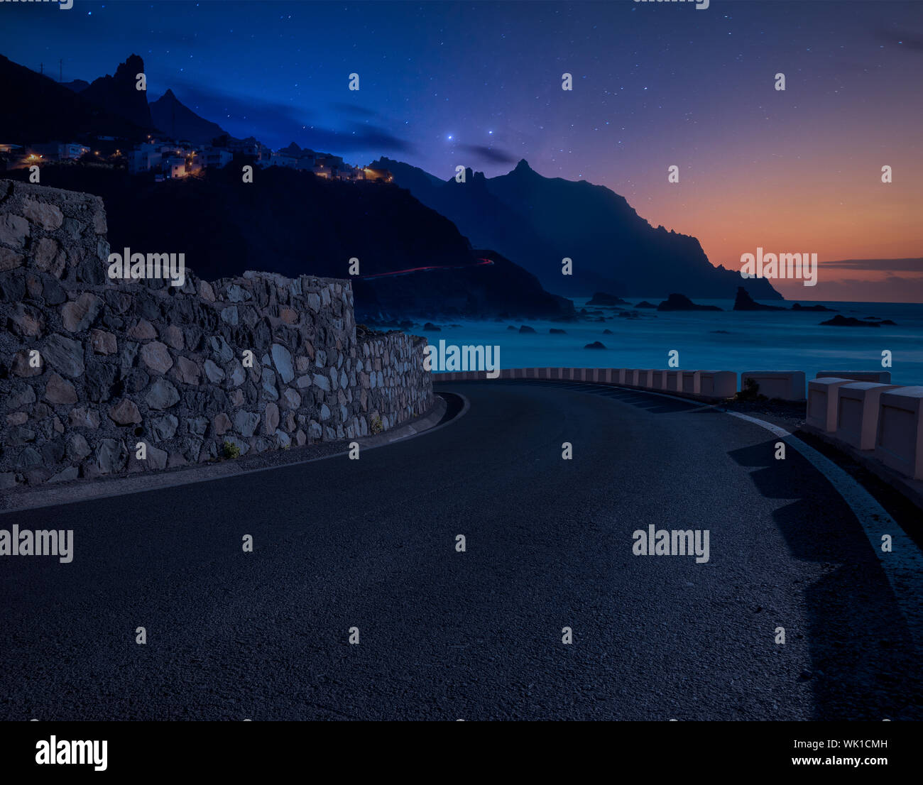 Road over the ocean at night Stock Photo - Alamy