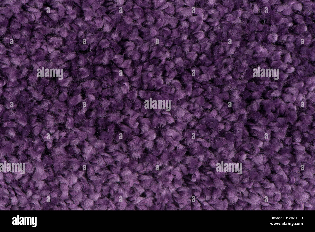 Closeup detail of purple carpet texture background Stock Photo - Alamy